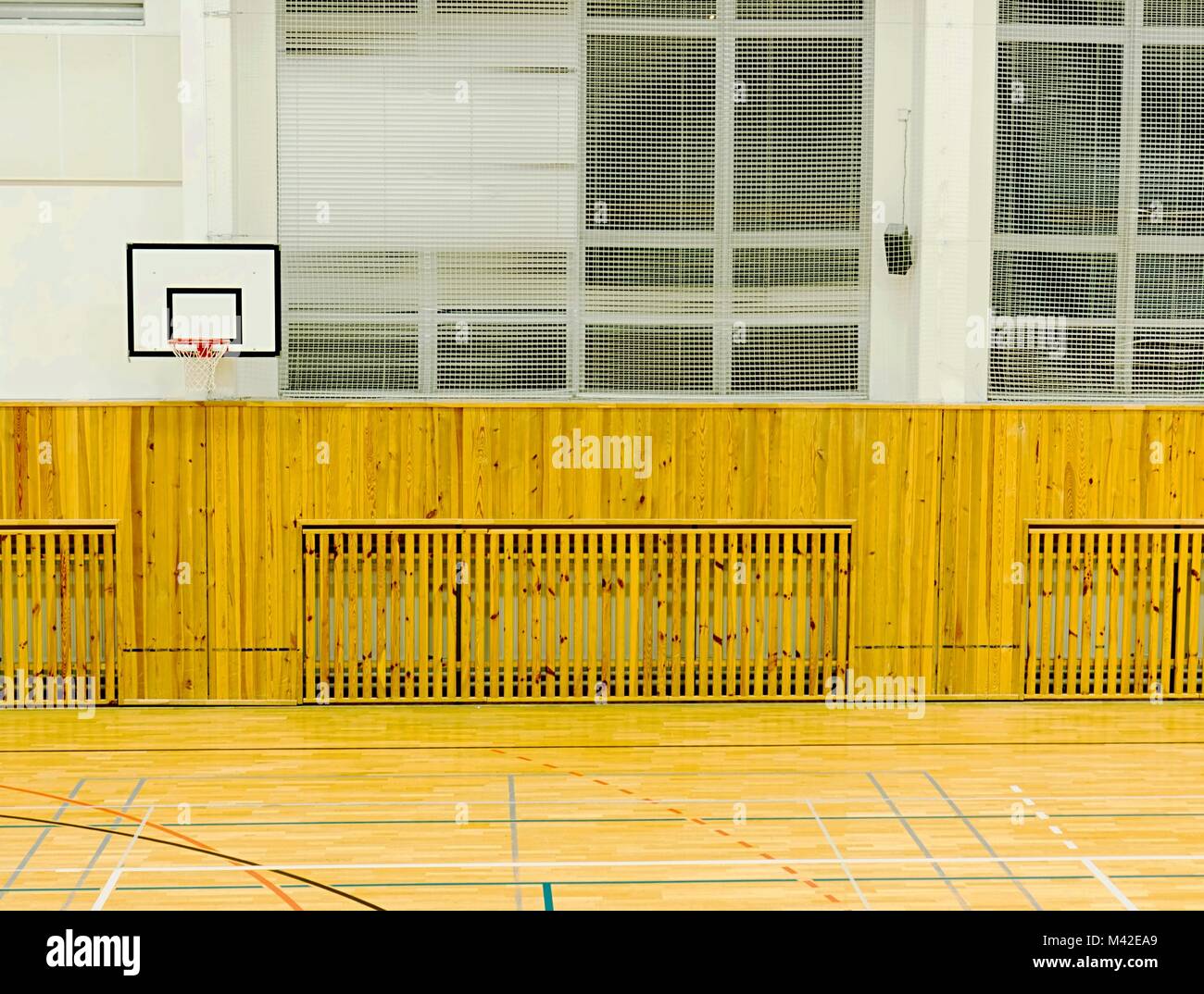 Basketball hoop on the wall. Empty basketball court. The school ...