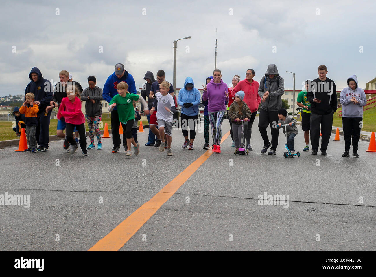 CAMP FOSTER, OKINAWA, Japan – Runners take off at the sound of a blow ...