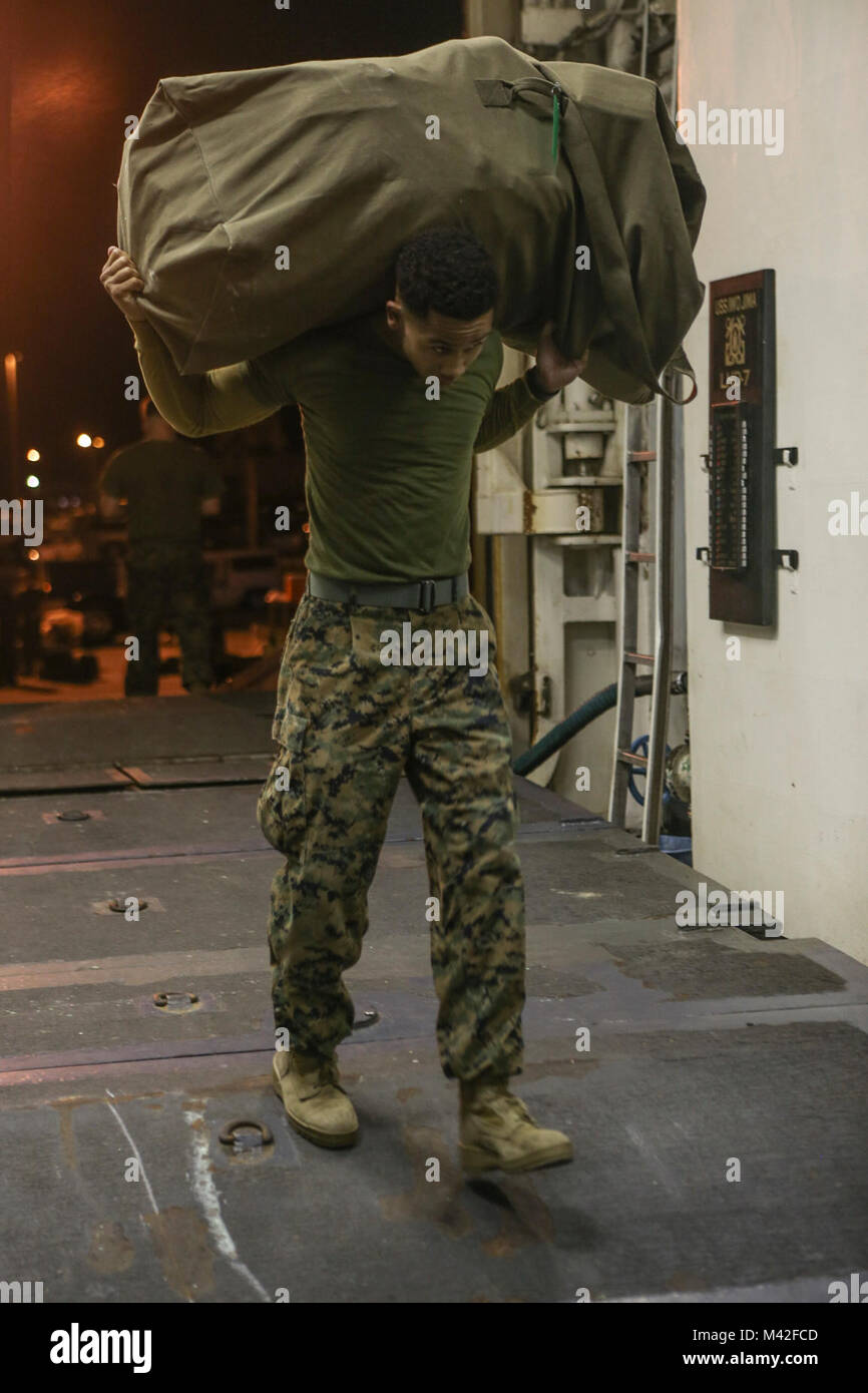 A U.S. Marine with the 26th Marine Expeditionary Unit (MEU), carries ...