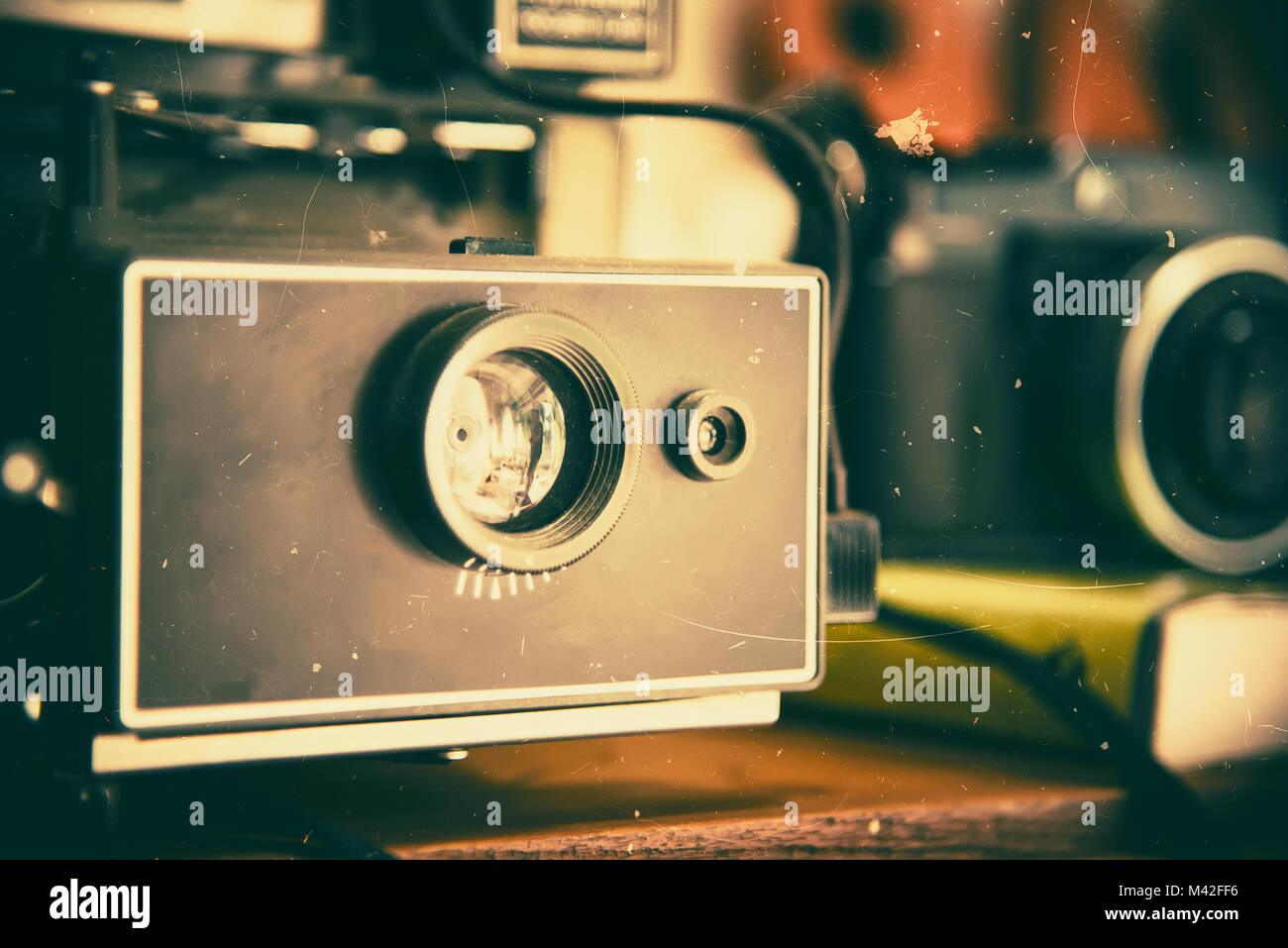 Retro camera on wood table background. Vintage camera. Film cameras ...