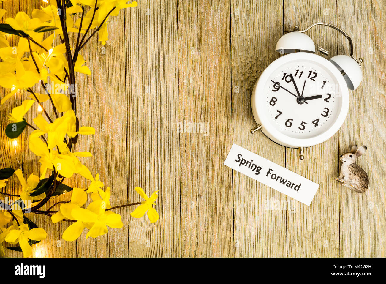 Daylight Savings Time Spring concept top down view with white clock and ...