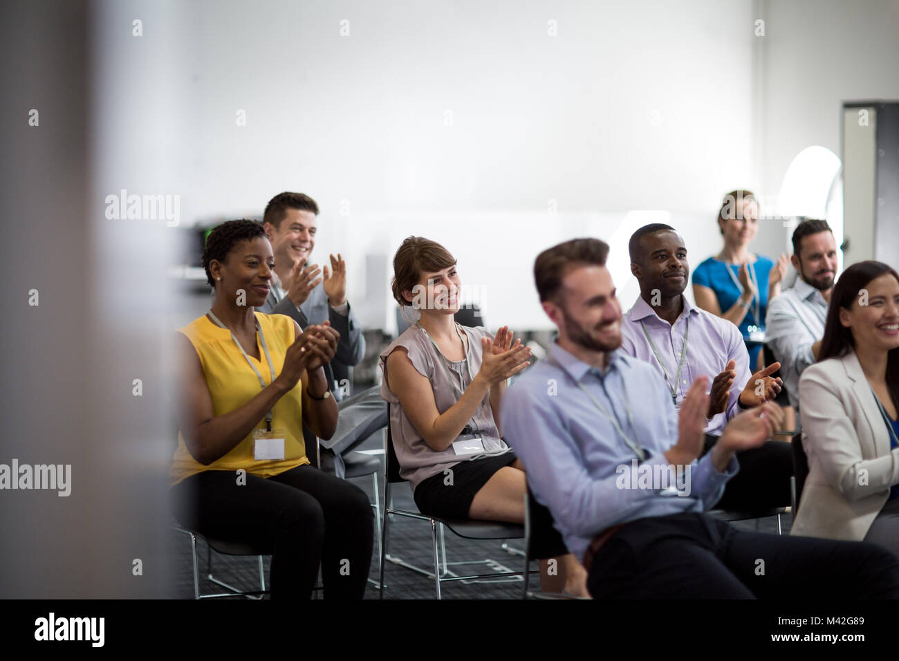 Audience at a conference applauding speaker Stock Photo - Alamy