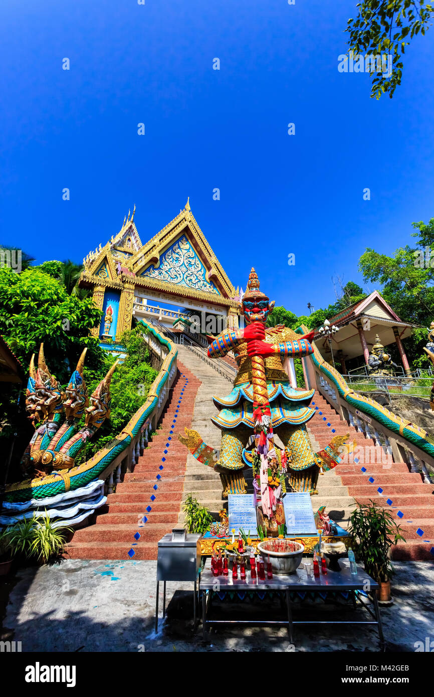 The main stairs leading to Wat Khao Rang temple with boards description ...