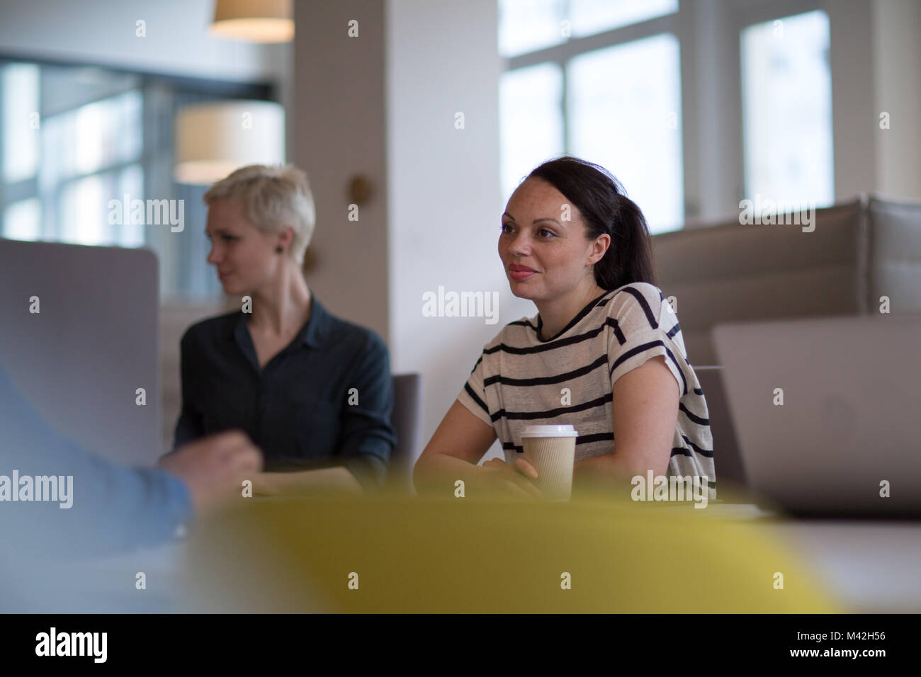Business colleagues in a morning meeting with coffee Stock Photo - Alamy