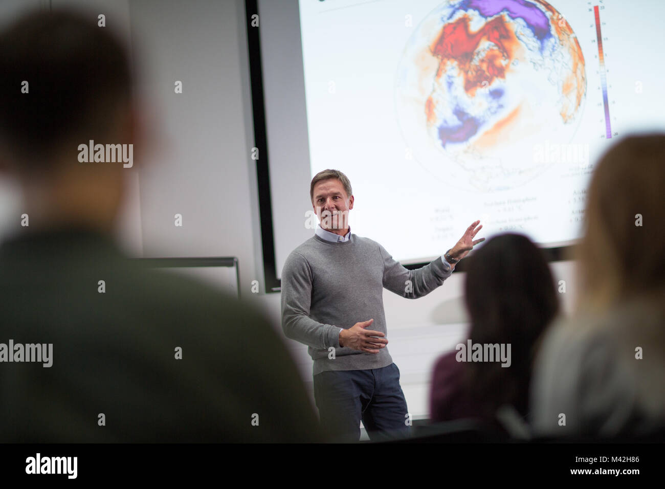 Teacher giving lecture at college Stock Photo - Alamy