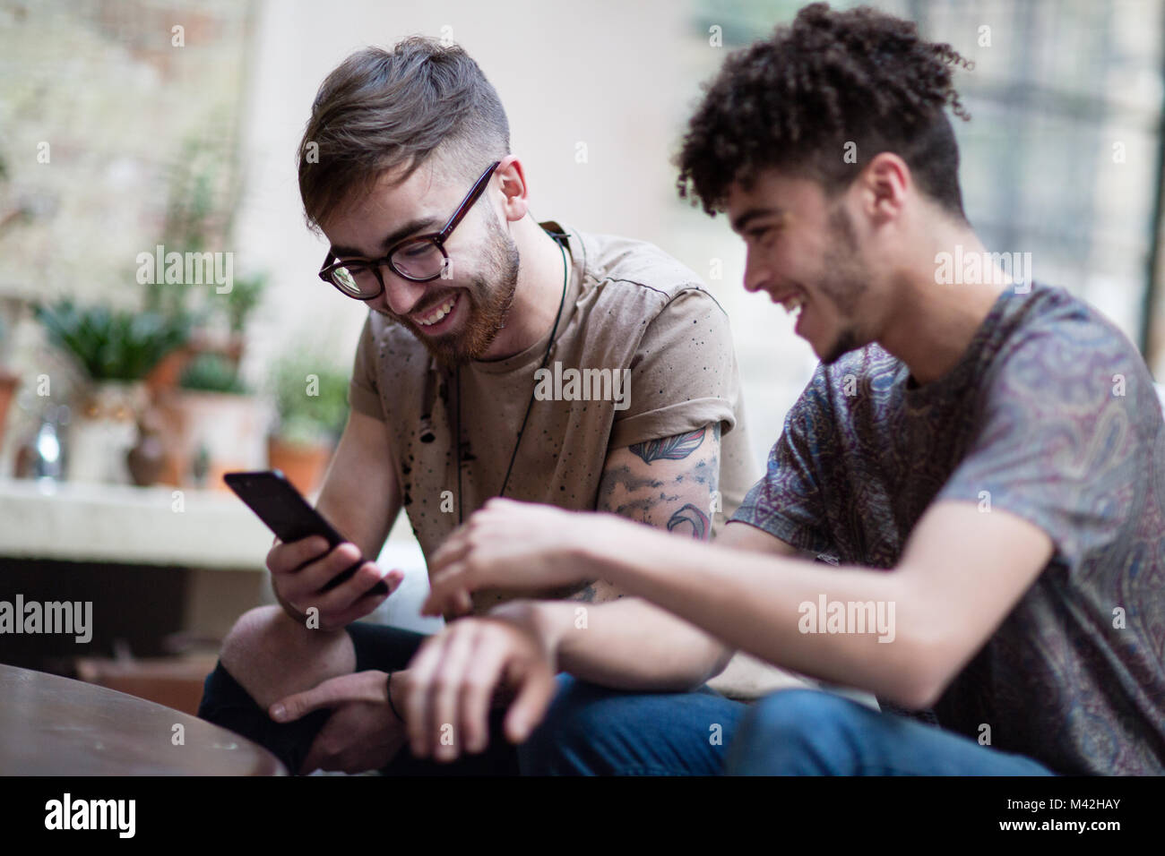 Two friends watching hi-res stock photography and images - Alamy