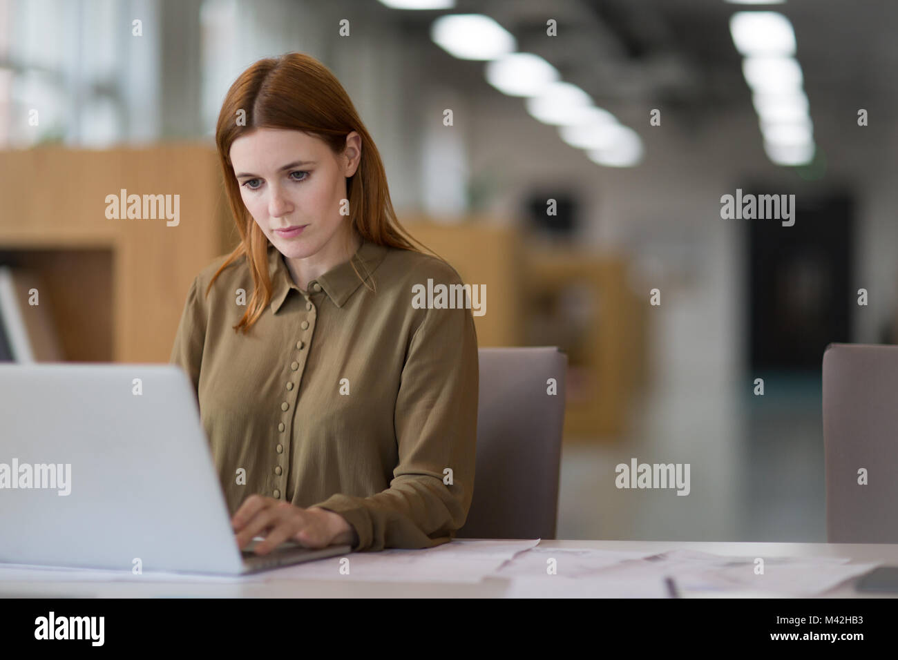 Woman working on laptop alone hi-res stock photography and images - Alamy