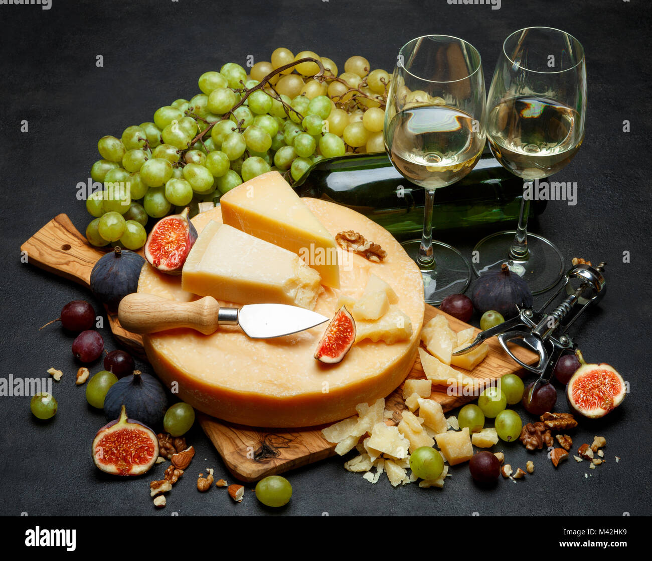 Whole round Head of parmesan or parmigiano hard cheese and wine Stock ...