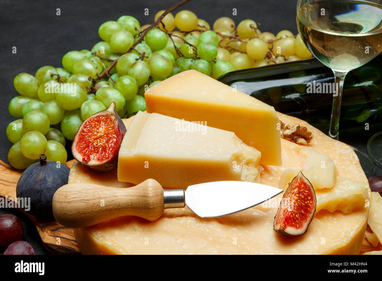 Whole round Head of parmesan or parmigiano hard cheese and wine Stock ...