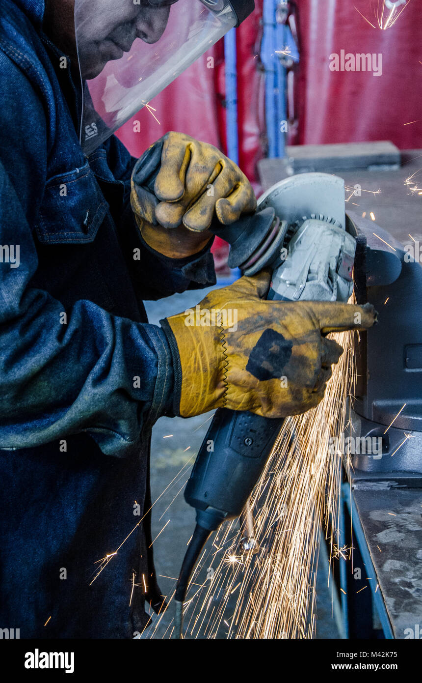 worker cutting iron with his tool Stock Photo - Alamy