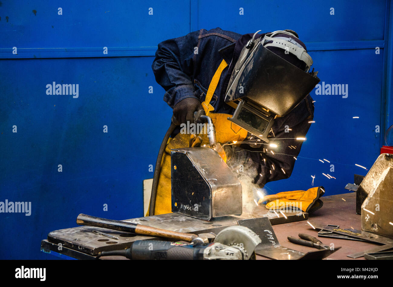worker cutting iron with his tool Stock Photo - Alamy