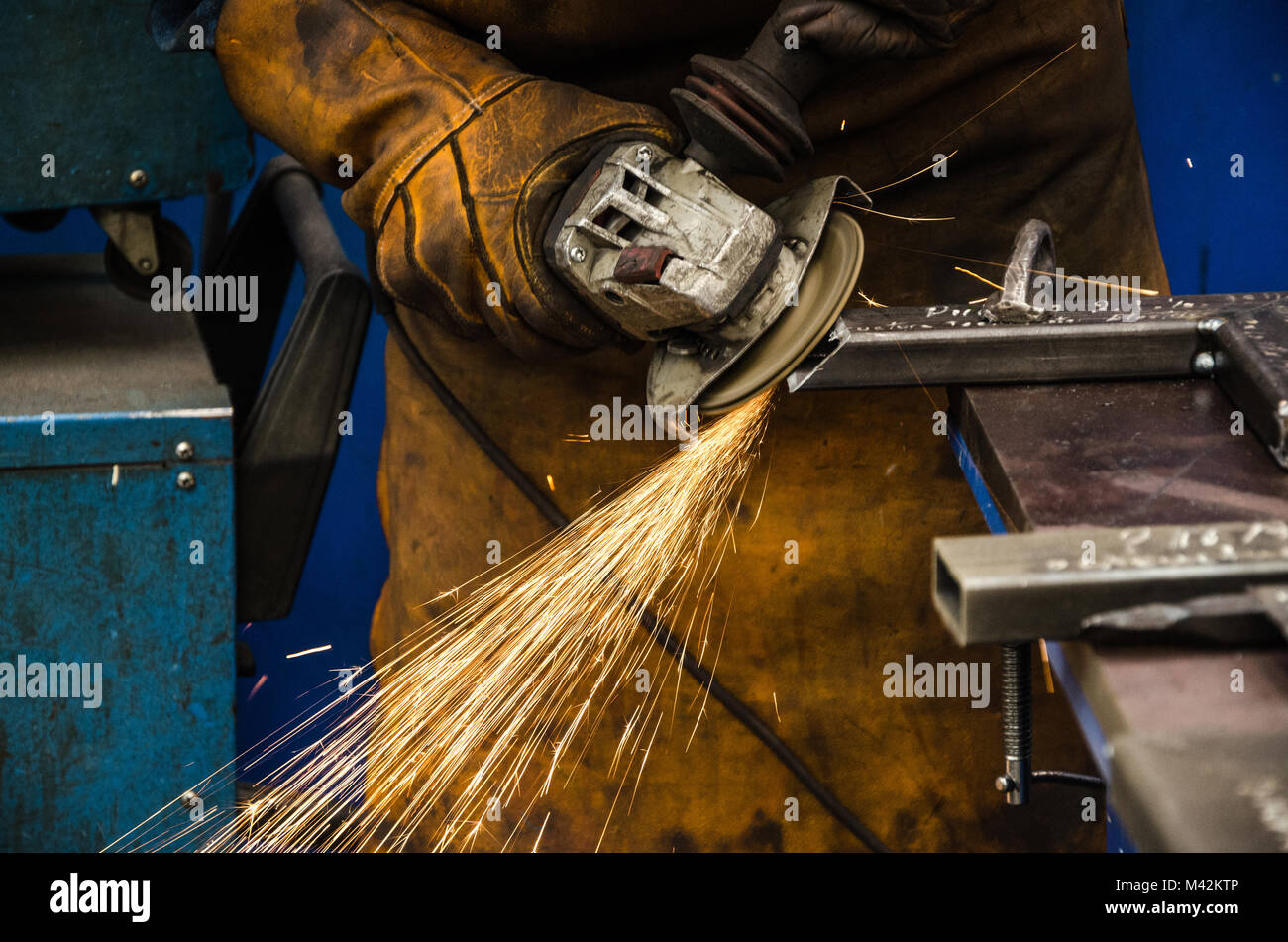 worker cutting iron with his tool Stock Photo - Alamy
