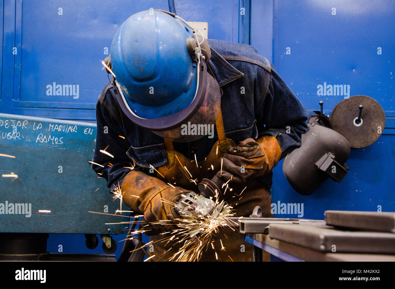 worker cutting iron with his tool Stock Photo - Alamy