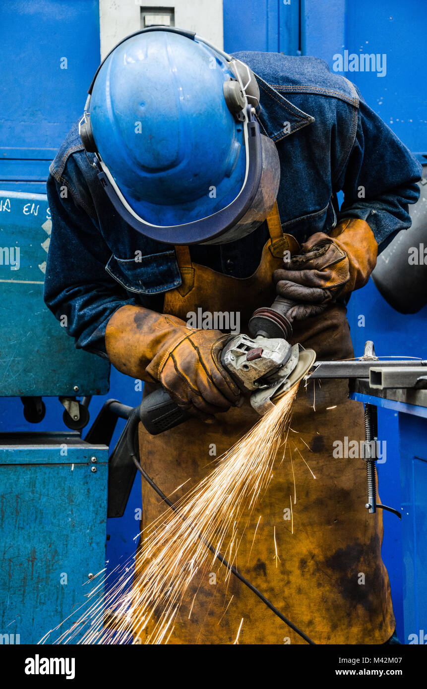 worker cutting iron with his tool Stock Photo - Alamy