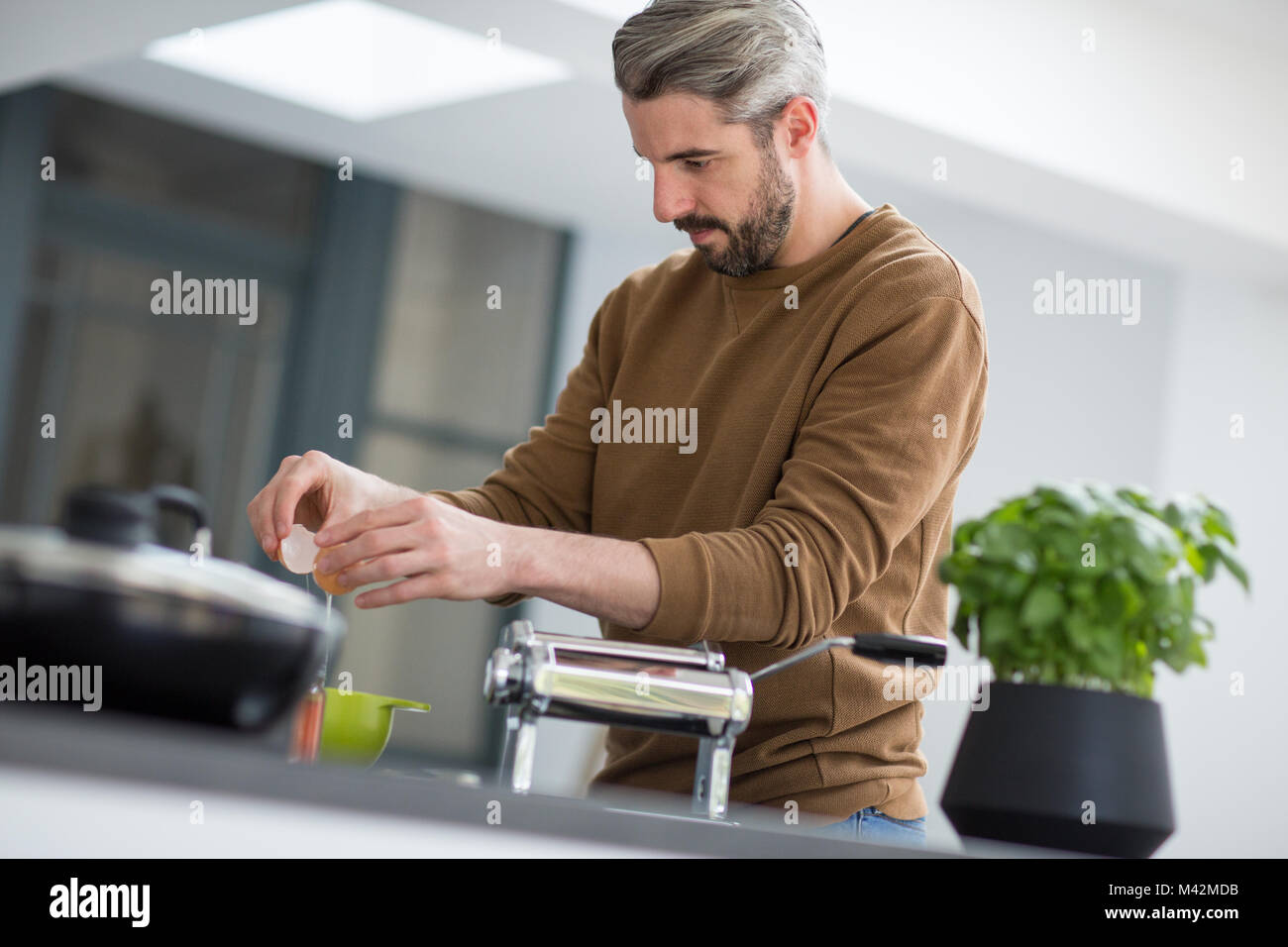 Adult male making fresh pasta Stock Photo - Alamy
