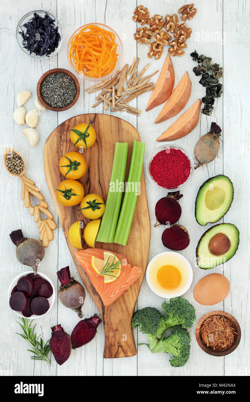 Brain health food nutrition concept with fish, vegetables, fruit, seeds ...