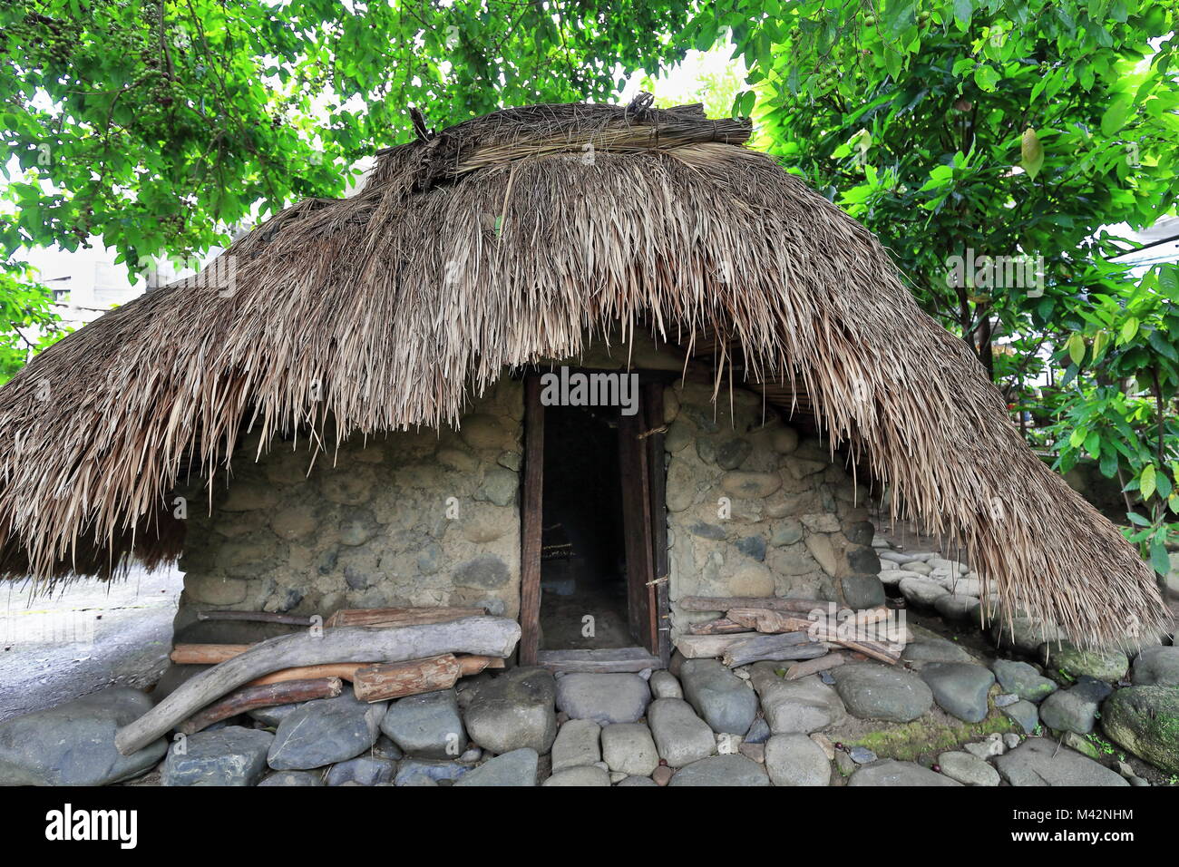 Ulog-communal masonry and thatch sleeping hut for young girls in a ...