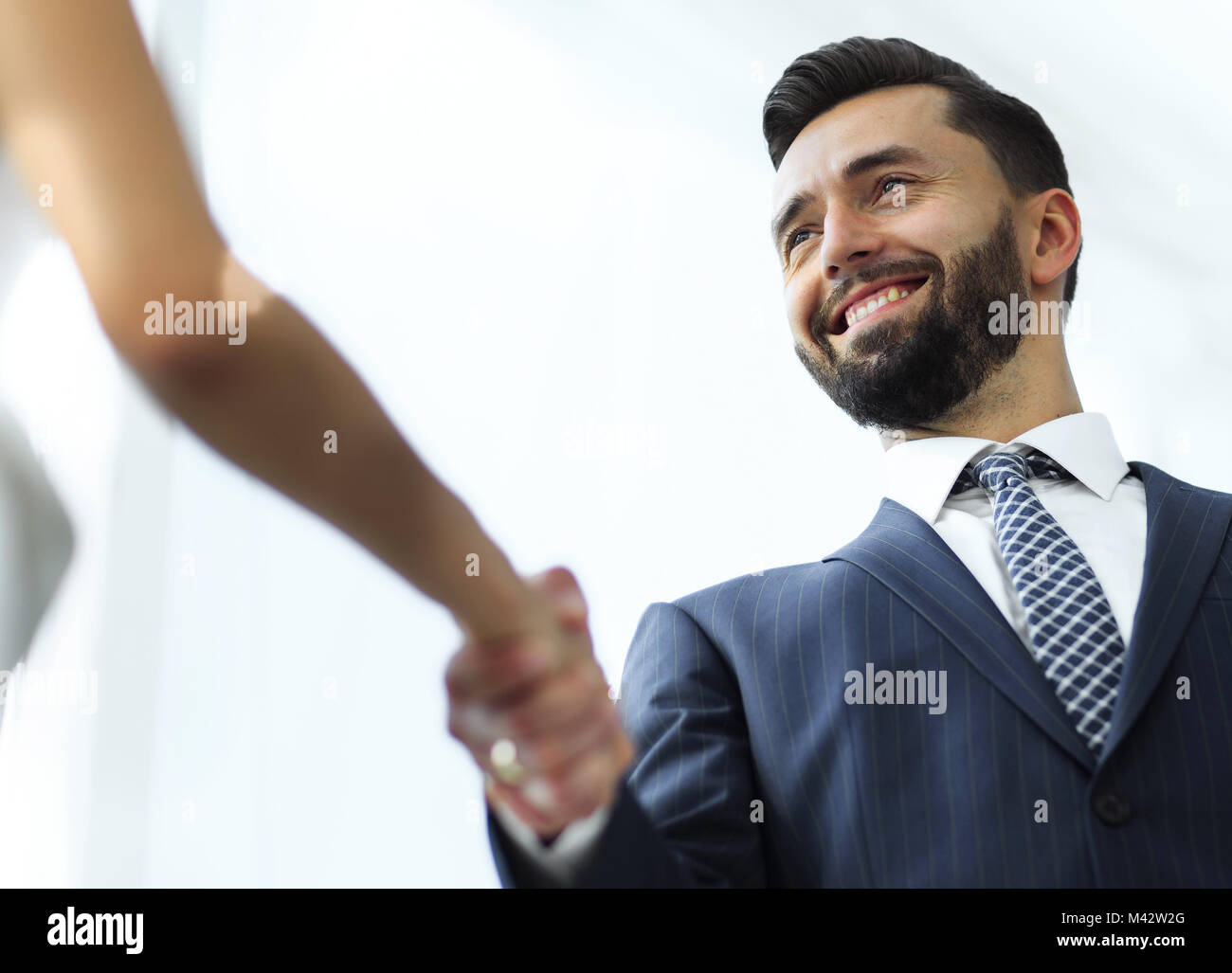 Image of business partners handshaking in office Stock Photo - Alamy