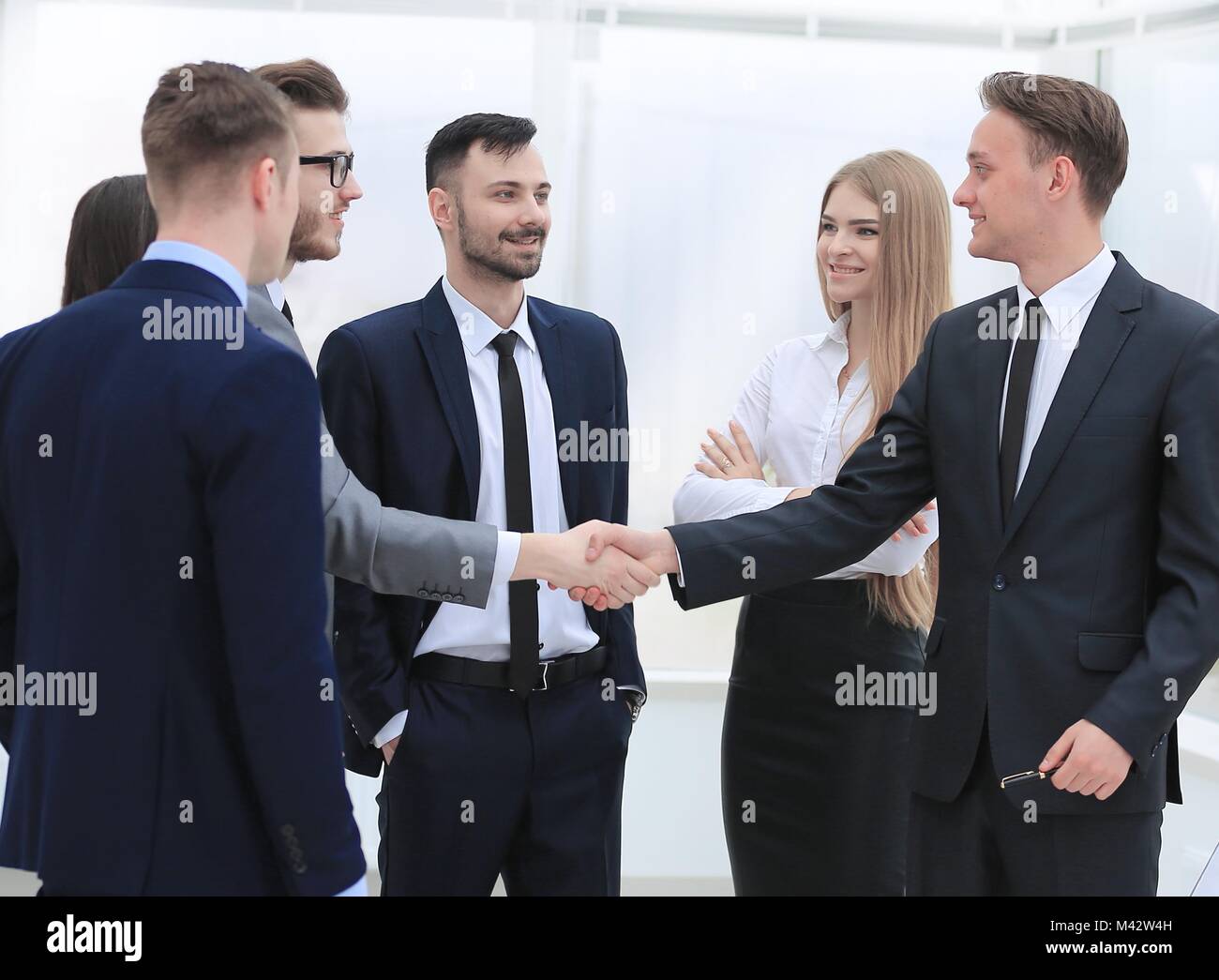 handshake Manager and the client in the office Stock Photo - Alamy