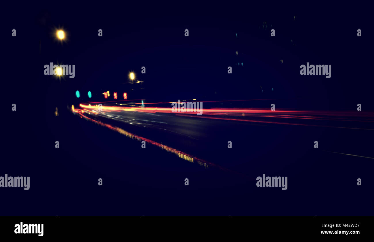 Blurry Illumination and night lights, car traffic motion blur the speed ...