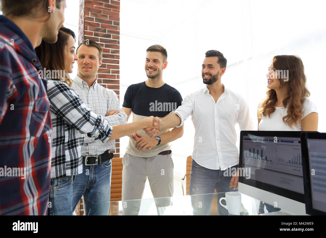 friendly handshake of partners in the office Stock Photo - Alamy
