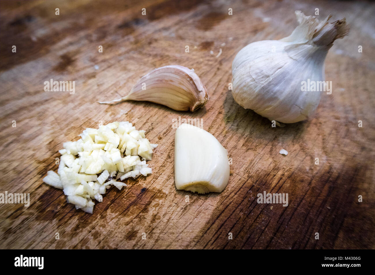 Garlic being chopped at different stage of the chopping process Stock ...
