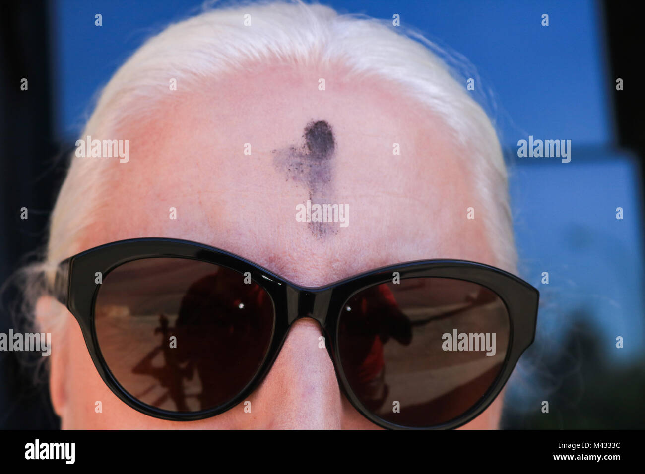 Adelaide, Australia. 14th Feb 2018. A cross of ashes is ceremonially ...