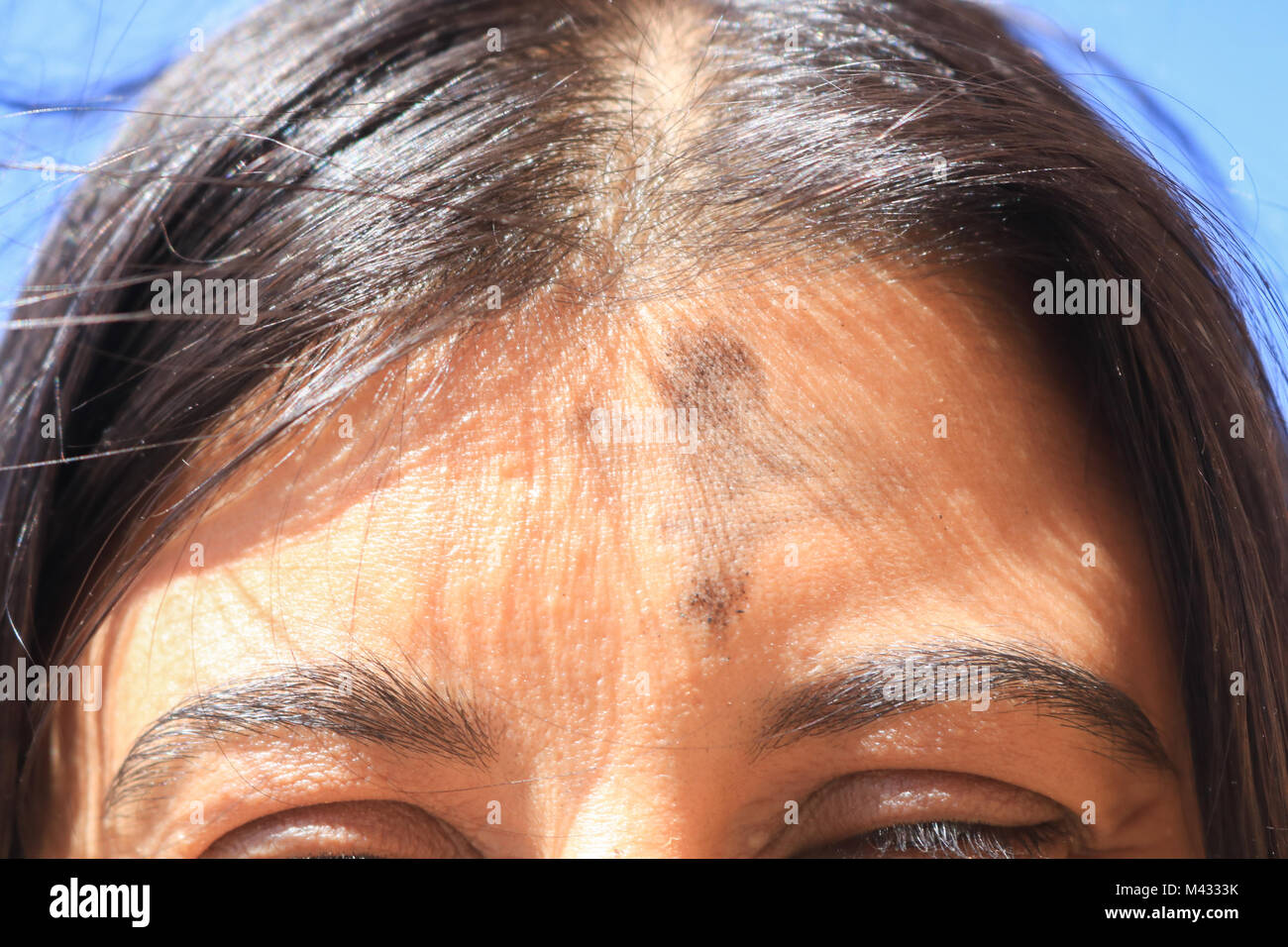 Adelaide, Australia. 14th Feb 2018. A cross of ashes is ceremonially ...