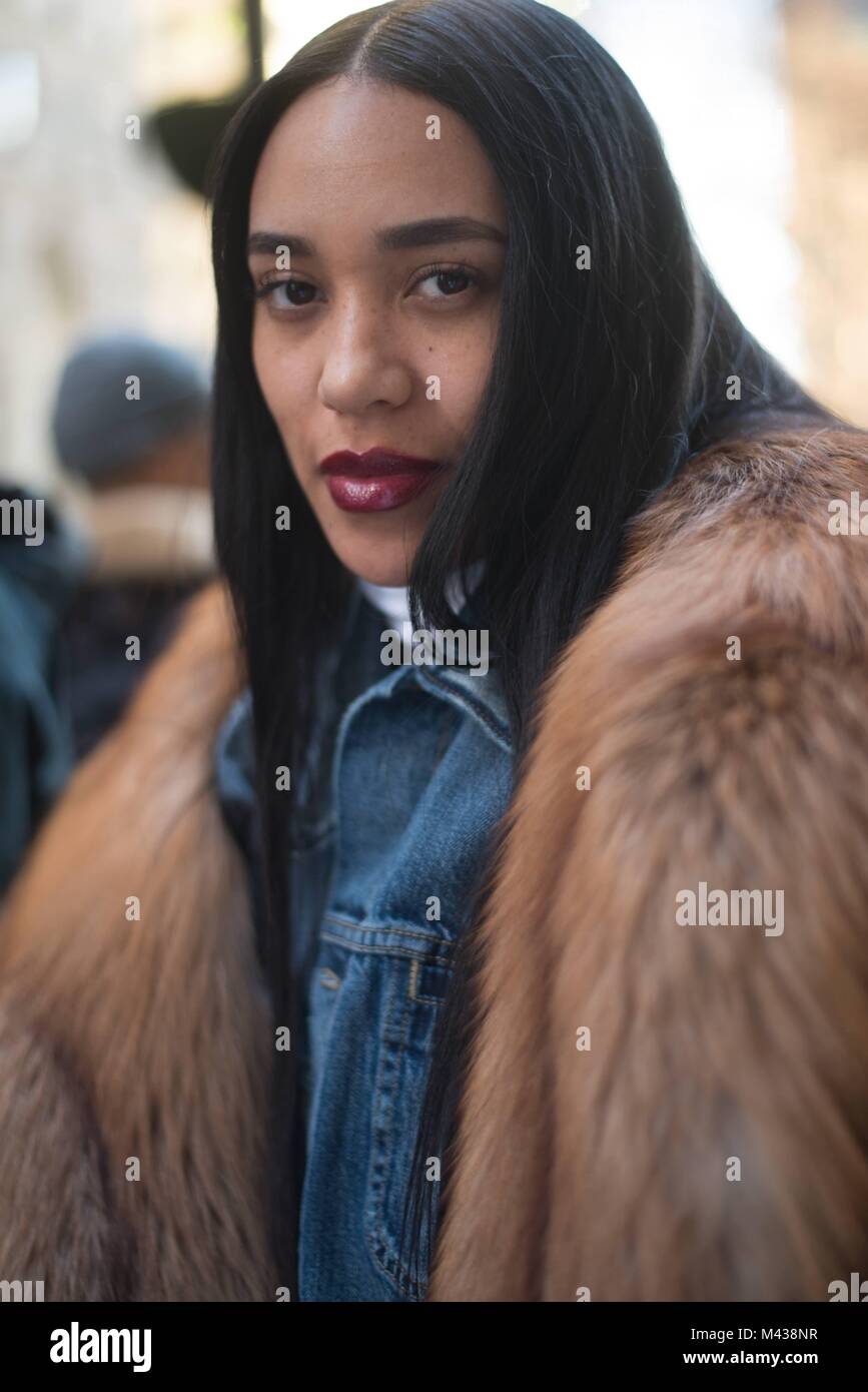 New York City, USA. 12th Feb, 2018. A chic showgoer arriving for a ...