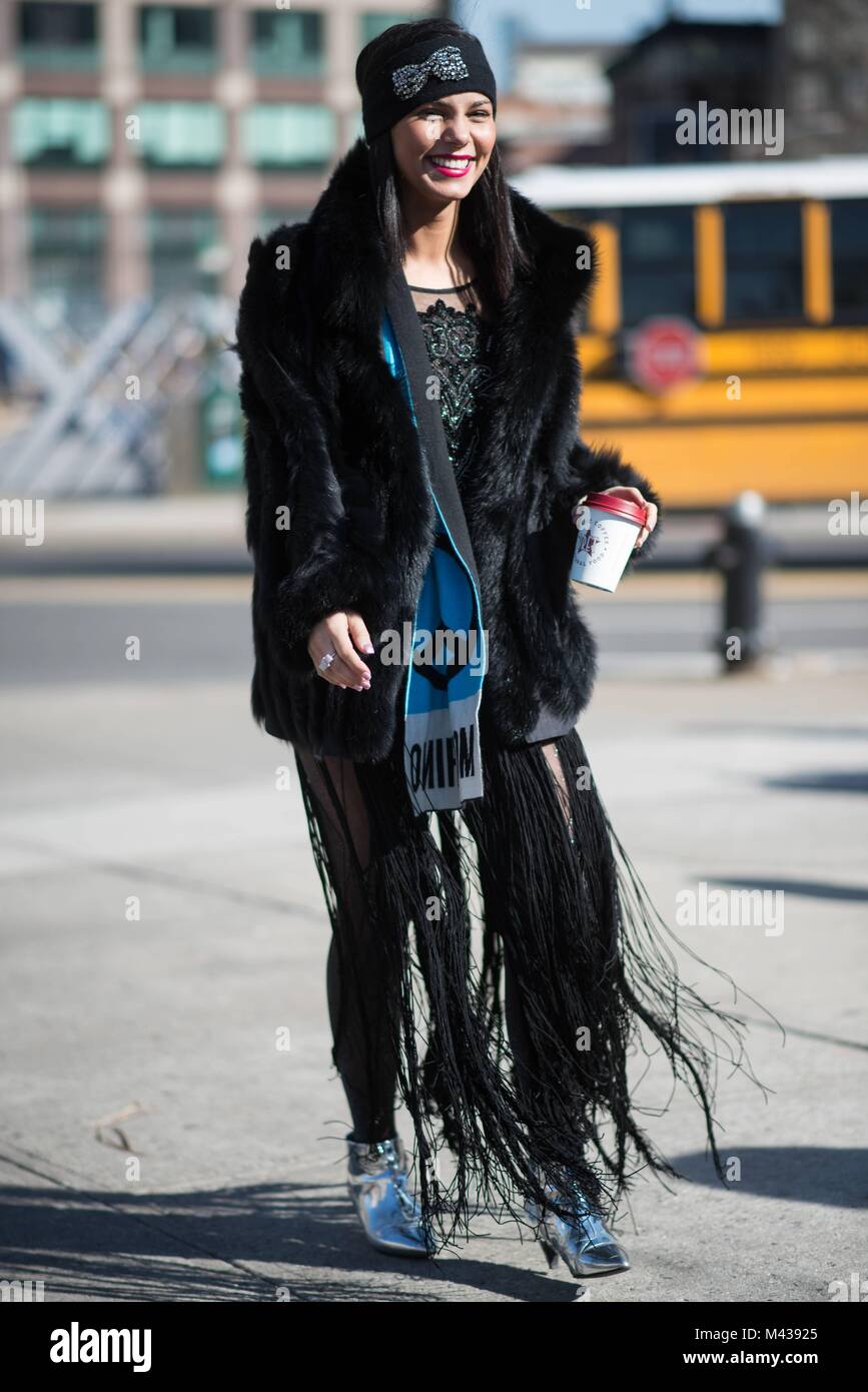 New York City, USA. 13th Feb, 2018. A chic showgoer arriving for a ...