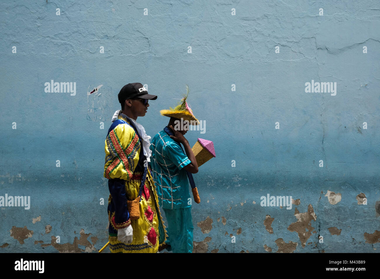 Two members of a Maracatu group wearing costumes during carnival in ...