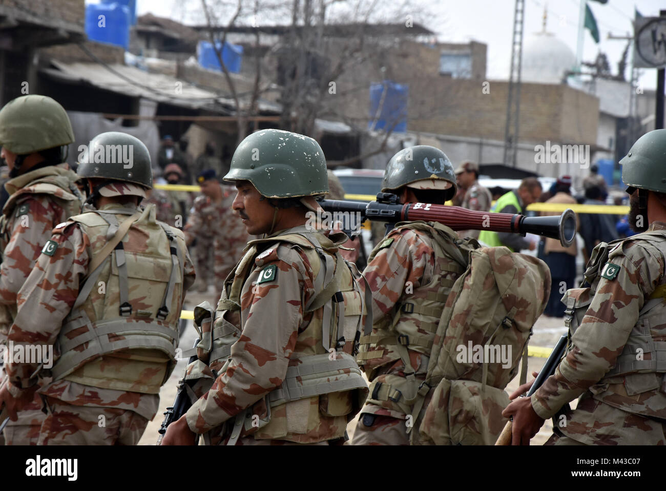 Quetta. 14th Feb, 2018. Security officials gather at the attack site in ...