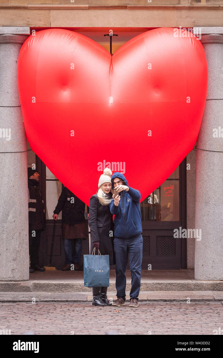 London, UK. 14 February 2018. Tourists takes a selfie with a giant ...