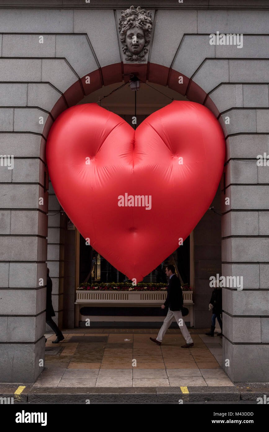 London, UK. 14 February 2018. A giant chubby heart balloon is seen at ...