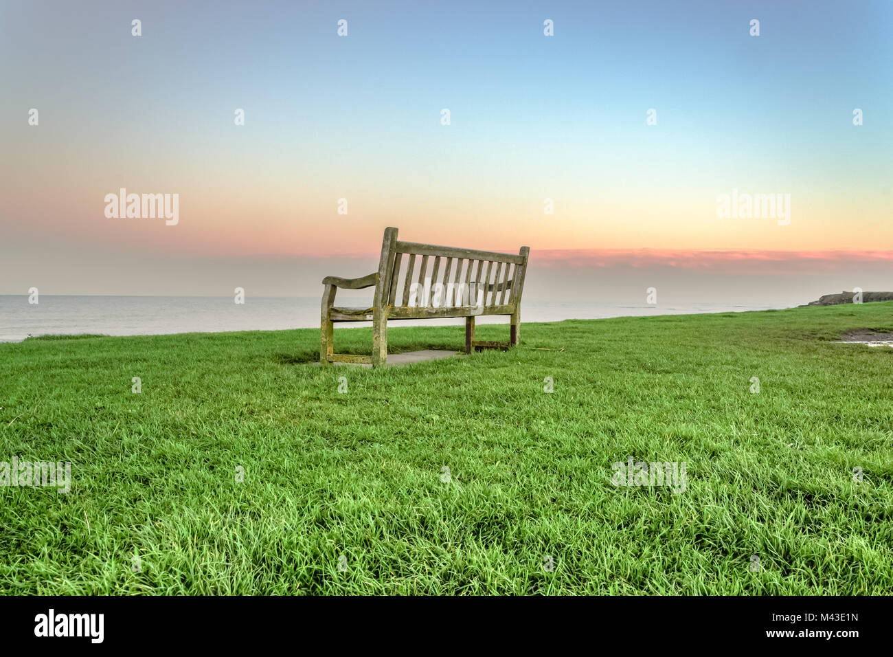 Bench on Grass with Beautiful Sky Stock Photo - Alamy