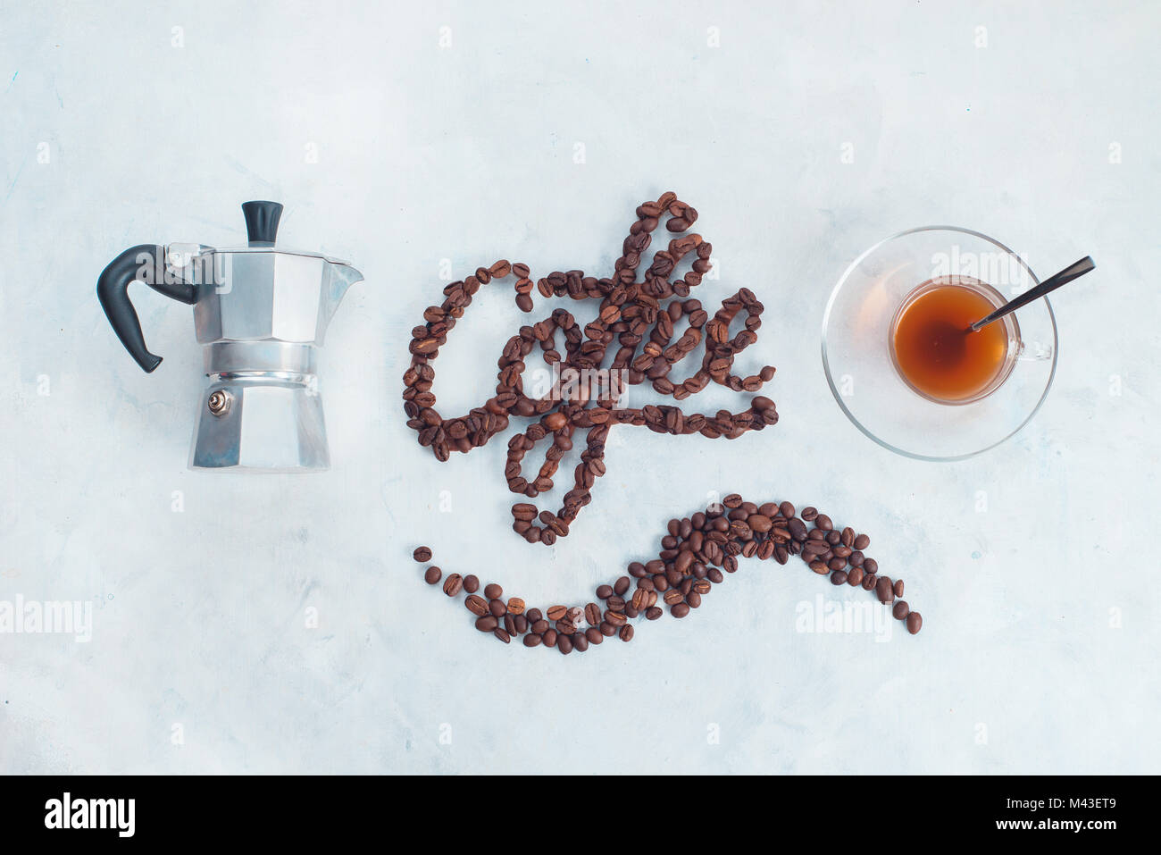 Minimalist flat lay with word Coffee made with coffee beans. Brewing ...