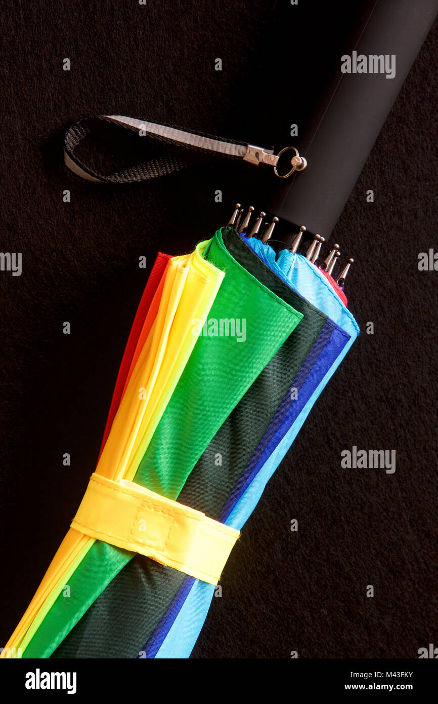 Closed multicoloured umbrella Stock Photo - Alamy