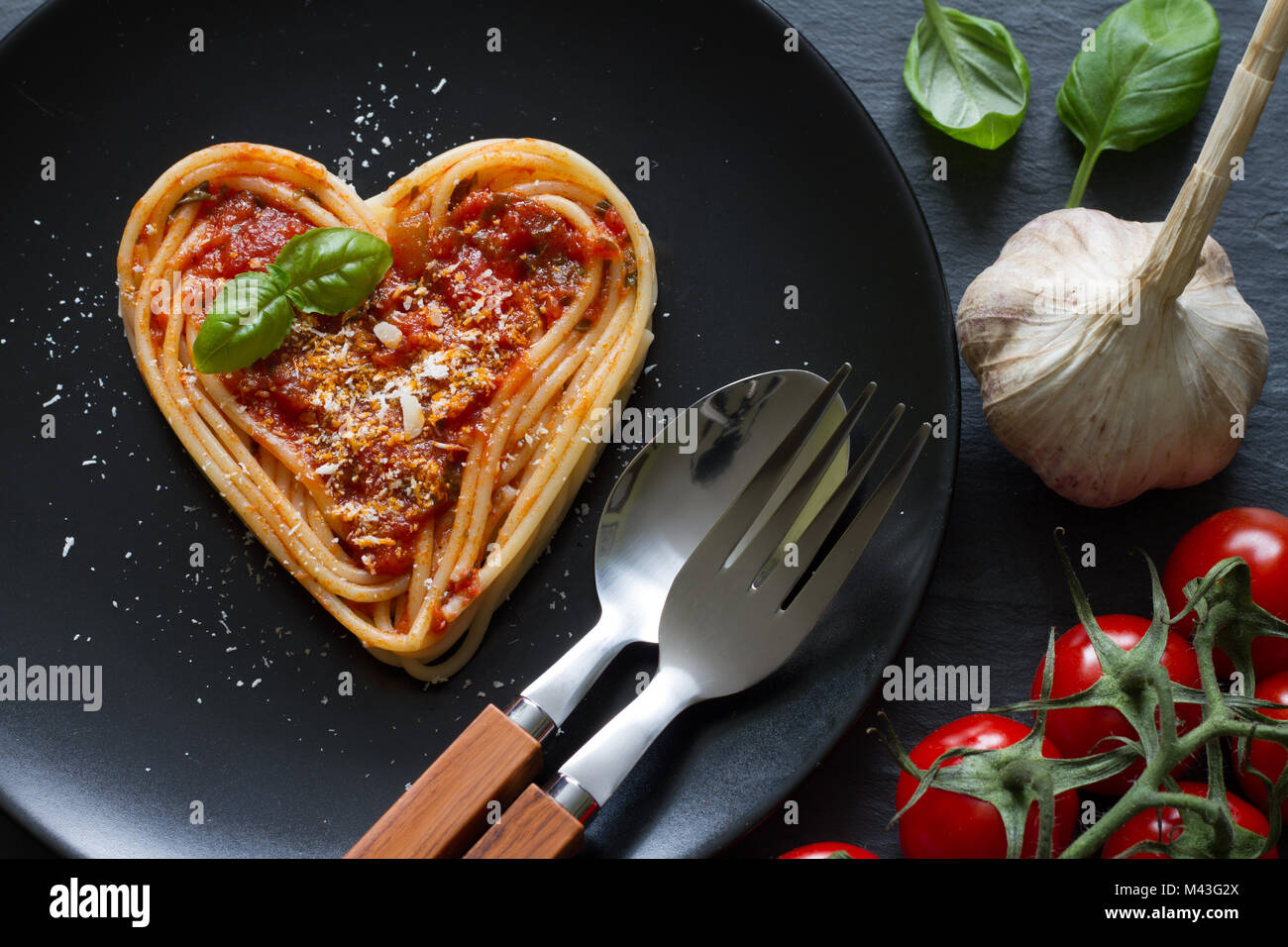 Spaghetti pasta heart love italian food diet abstract concept on black ...