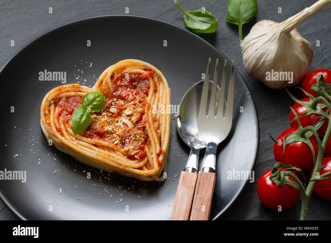 Spaghetti pasta heart love italian food diet abstract concept on black ...