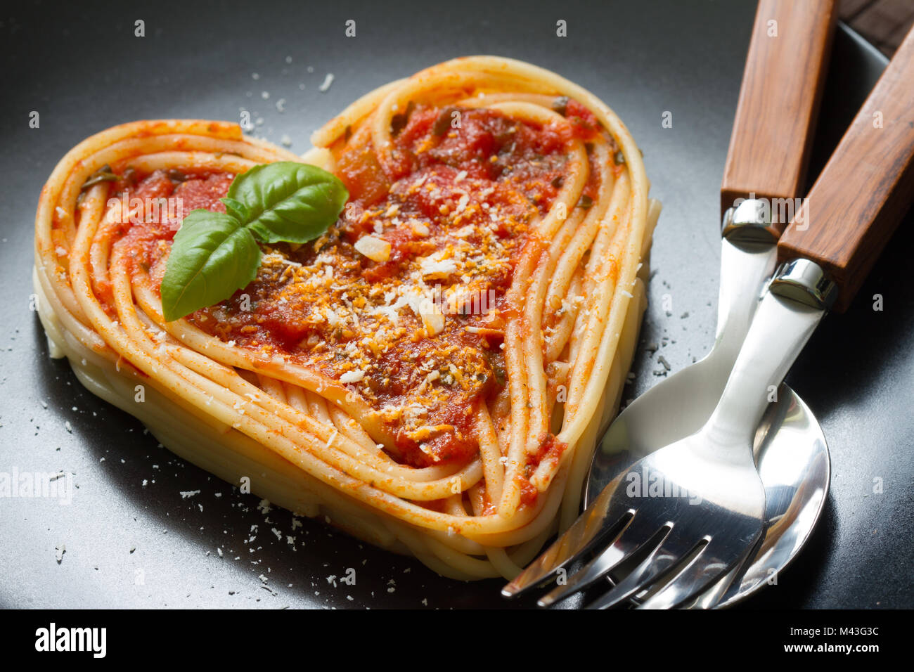 Spaghetti pasta heart love italian food diet abstract concept on black ...