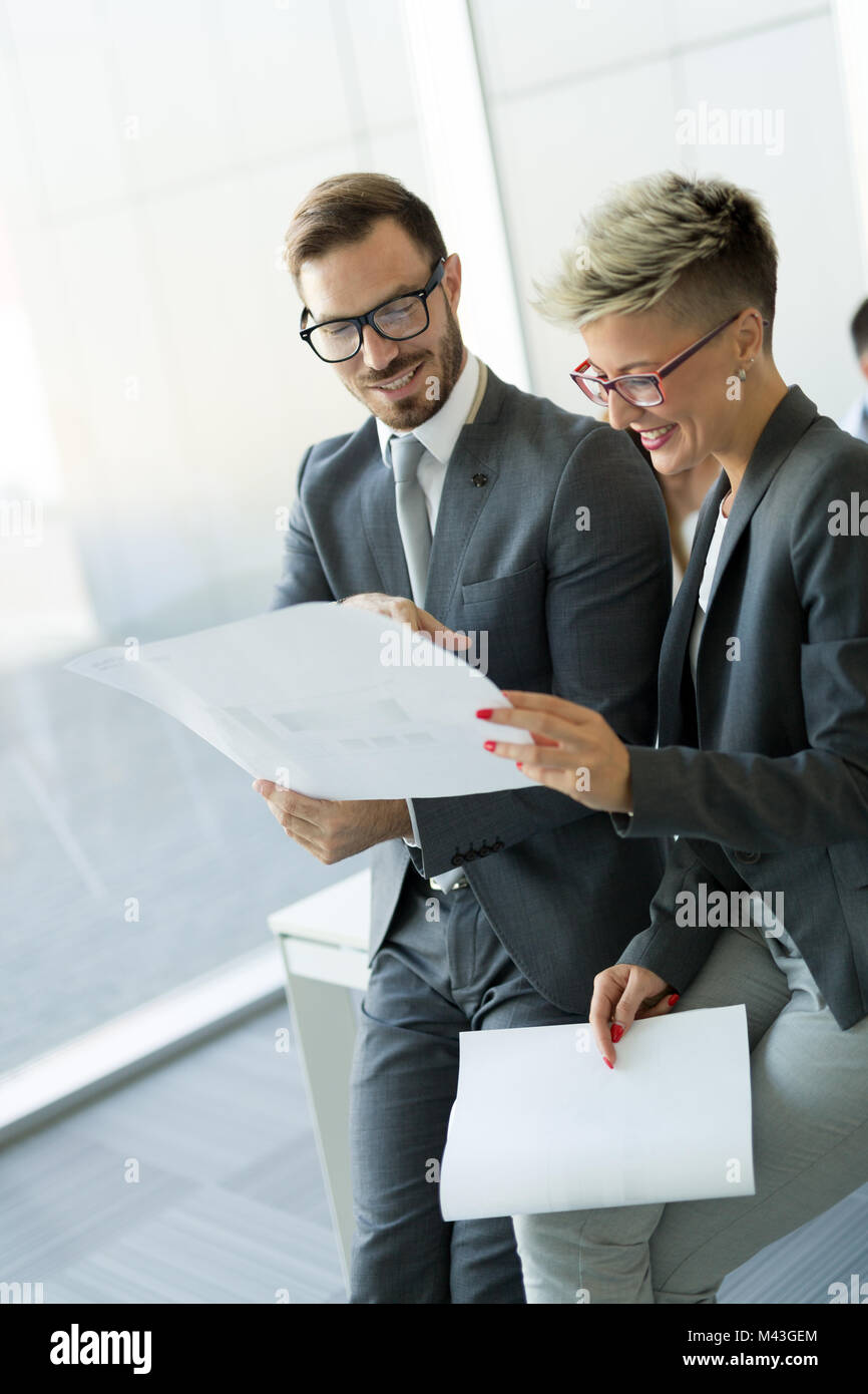 Picture of business colleagues talking in office Stock Photo - Alamy