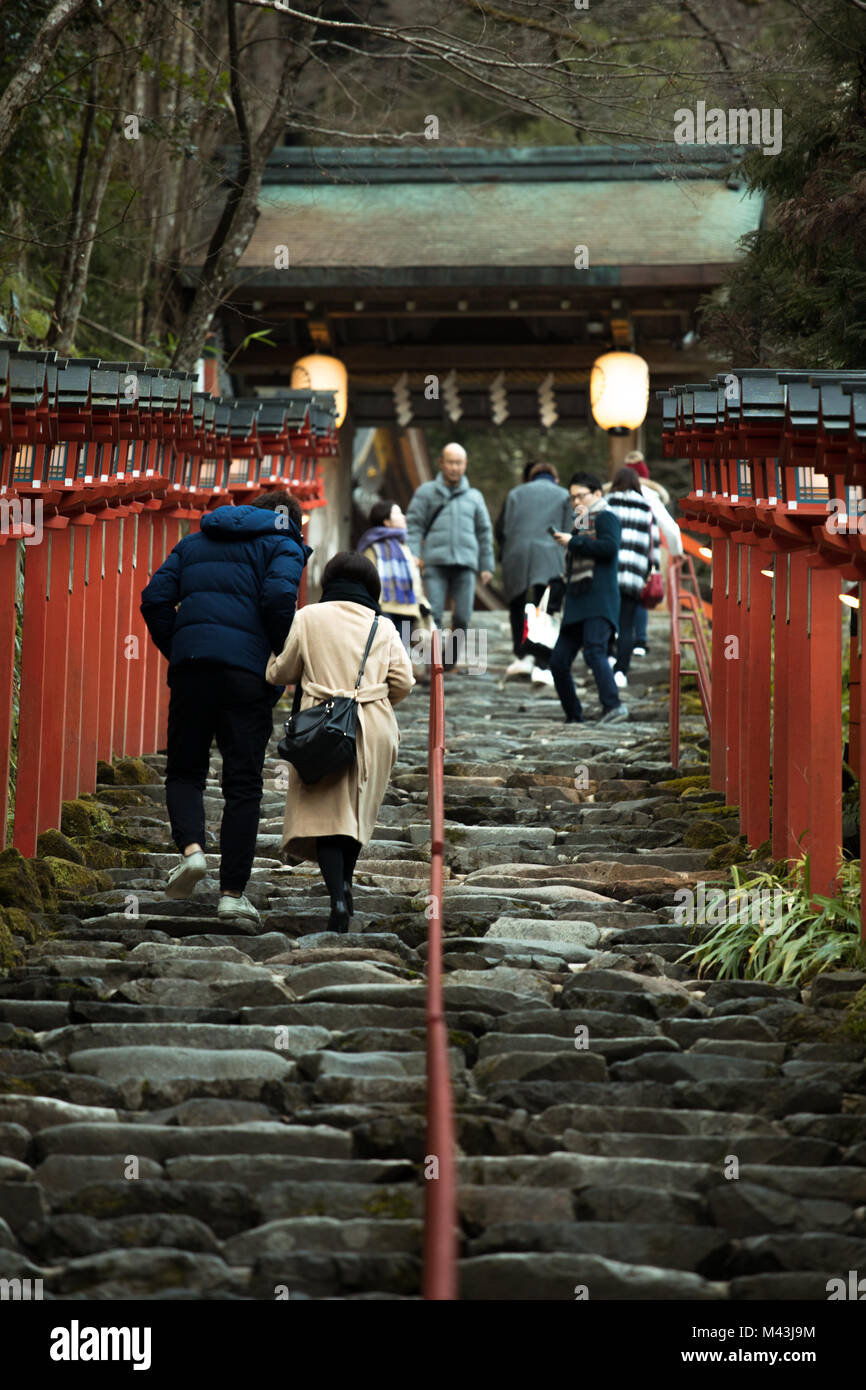 Scenic pathway lined with hundreds of red torii gates at Fushimi Inari ...