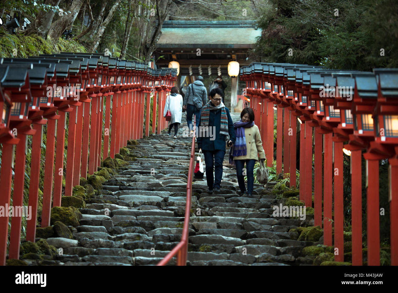 Scenic pathway lined with hundreds of red torii gates at Fushimi Inari ...