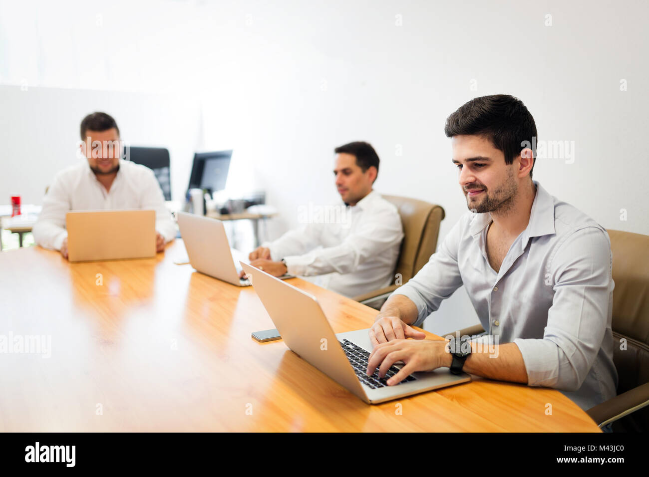 Picture of businesspeople working in modern office Stock Photo - Alamy