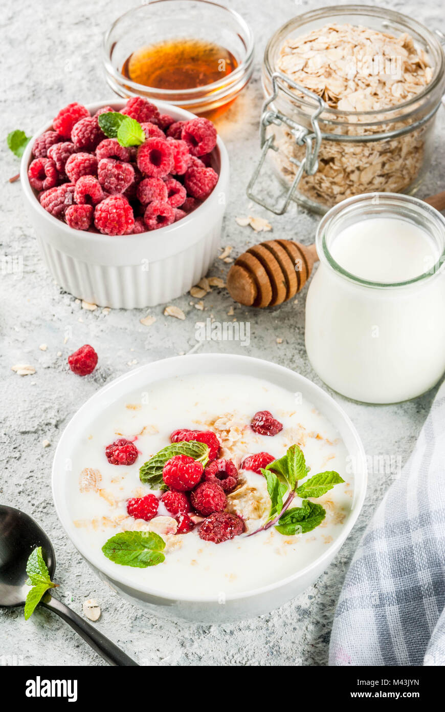 Raw ingredients for summer healthy breakfast, cereals (oats), fresh ...