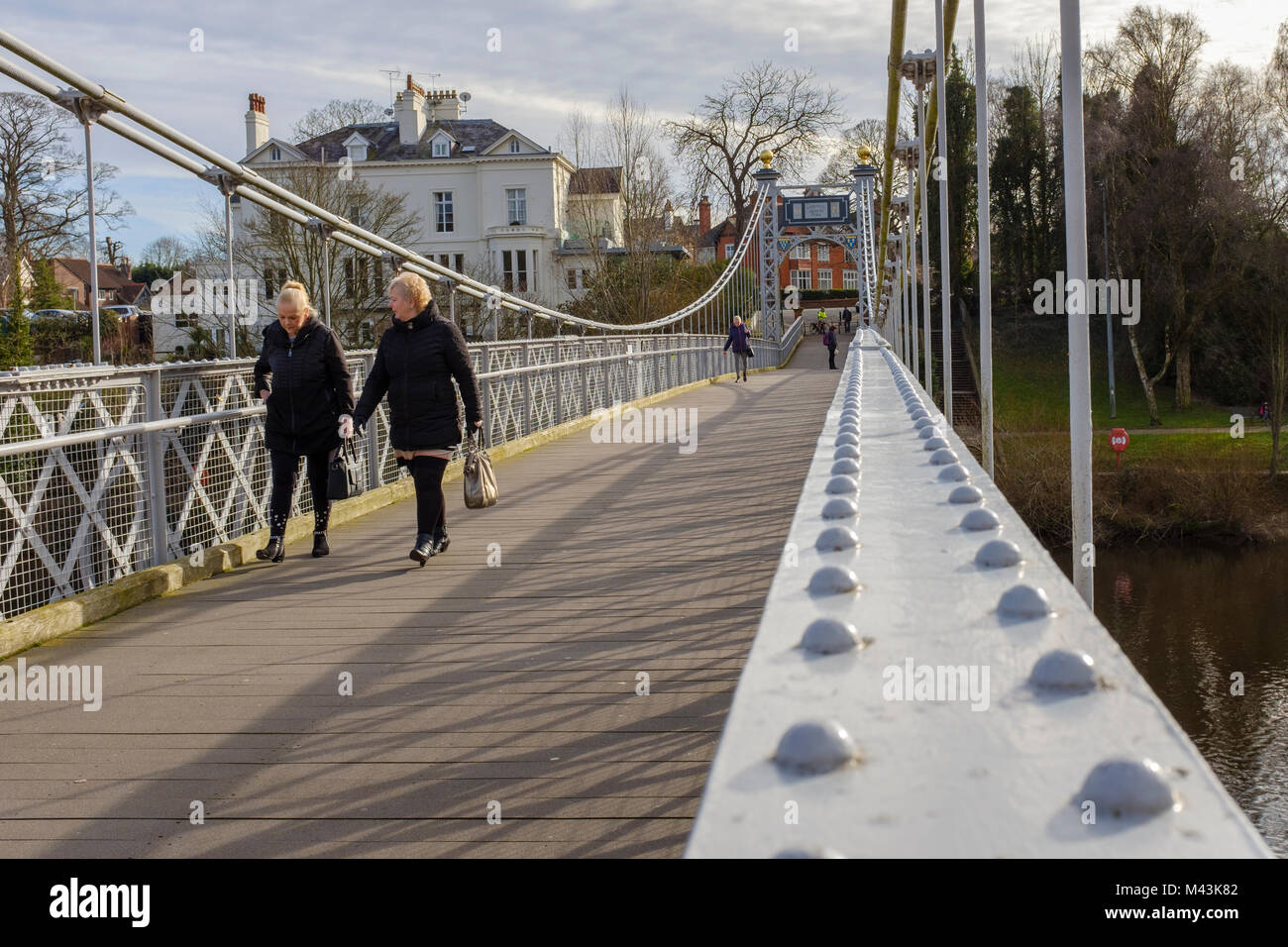Two woman crossing the Queens Park bridge in Chester. The bridge ...