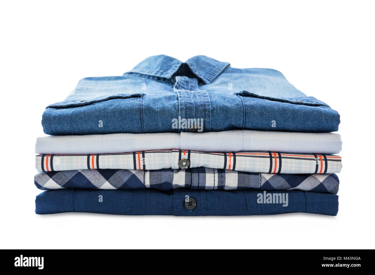 Stack of shirts isolated on white background Stock Photo - Alamy