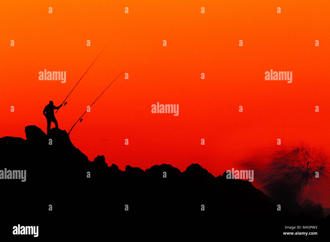 Fishing in the rocks Stock Photo - Alamy
