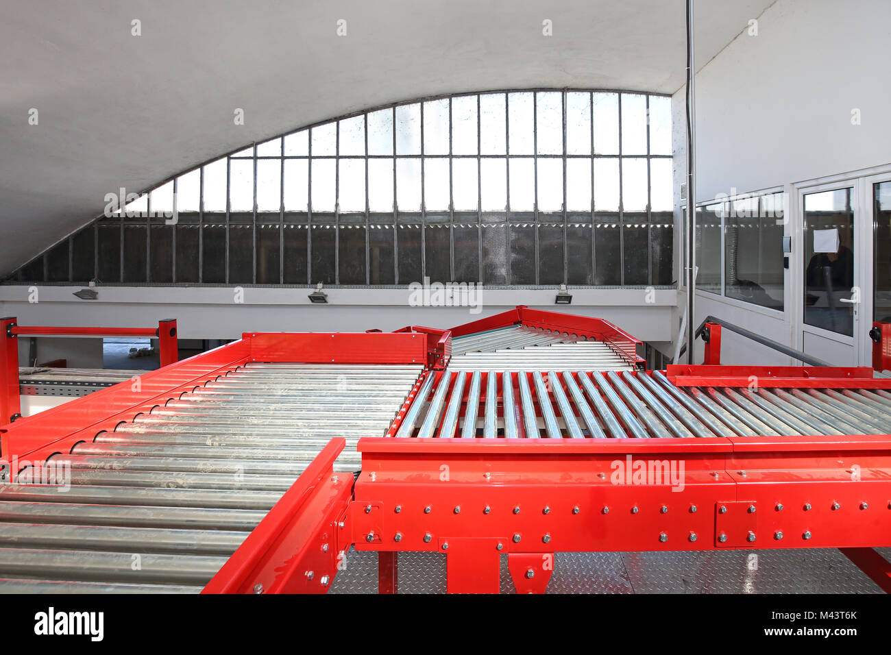 Conveyor Rollers in Sorting and Shipping Warehouse Stock Photo - Alamy