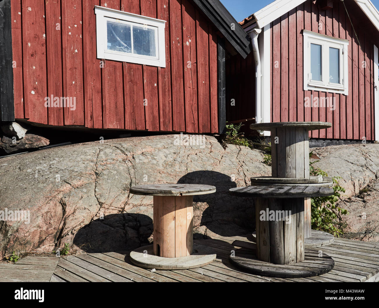 Giant wooden cable reels outside timber cabins, Stockholm archipelago ...